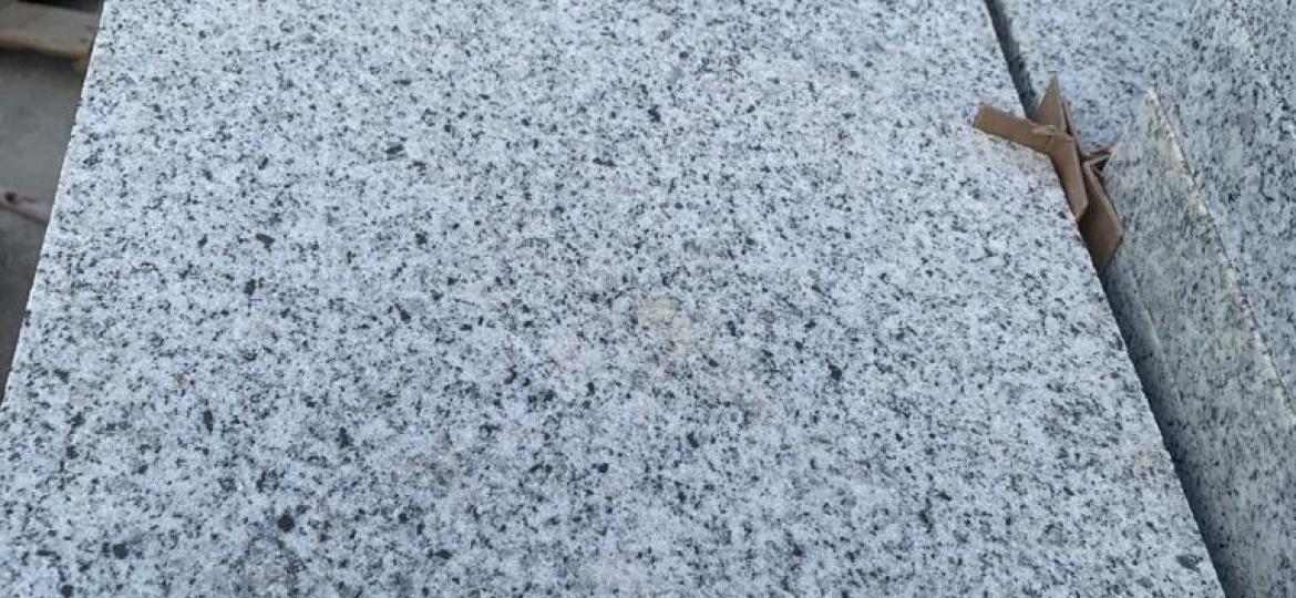 light grey granite in sandblasted finish and parallelogram form