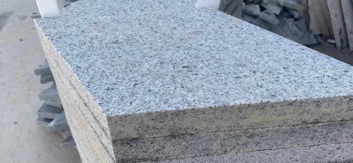 light grey granite in sandblasted finish and parallelogram form